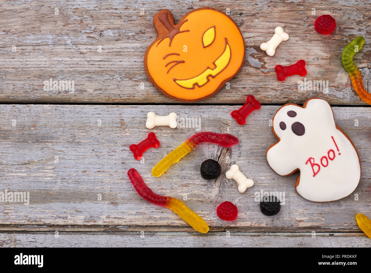 Halloween sweets on wooden background Stock Photo - Alamy