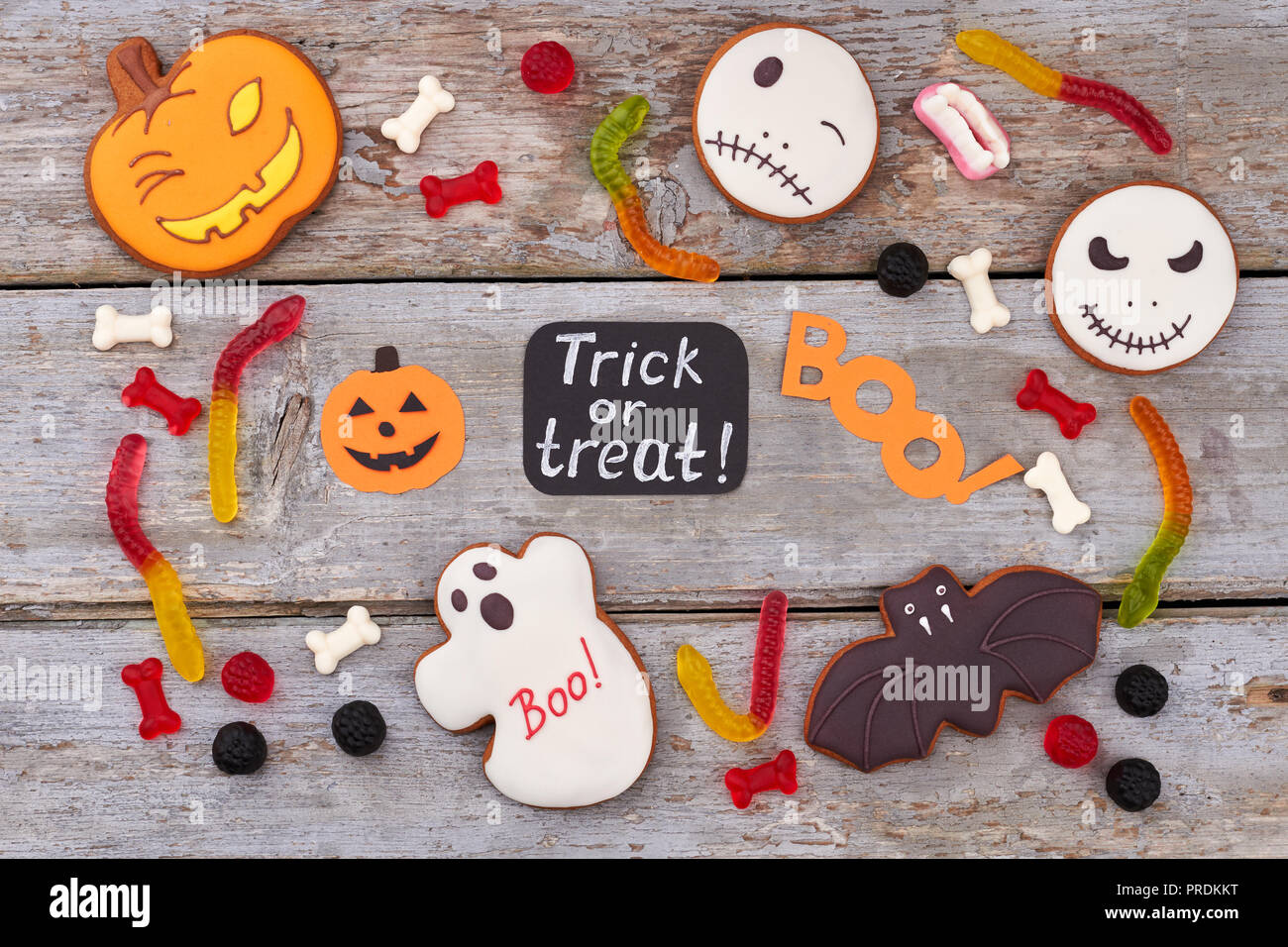 Halloween sweets on wooden background Stock Photo - Alamy
