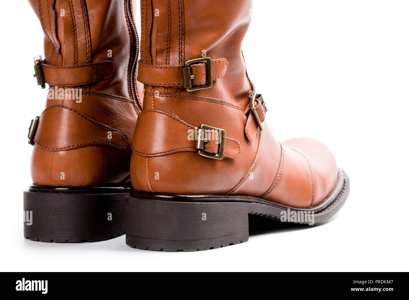 pair of brown boots closeup on white background Stock Photo - Alamy