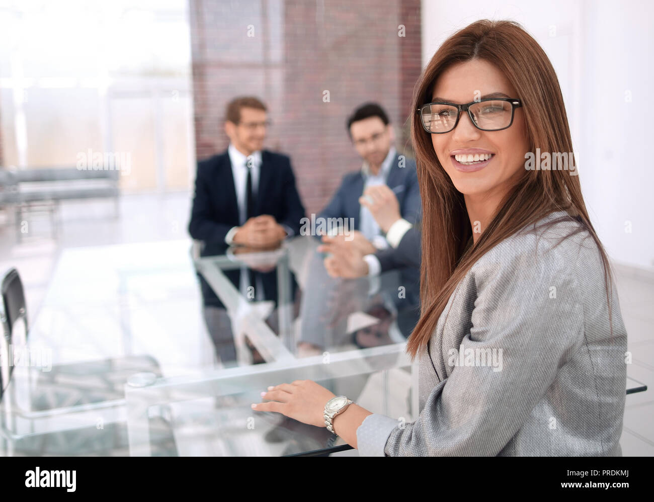successful business woman sitting at a table in the meeting room Stock ...