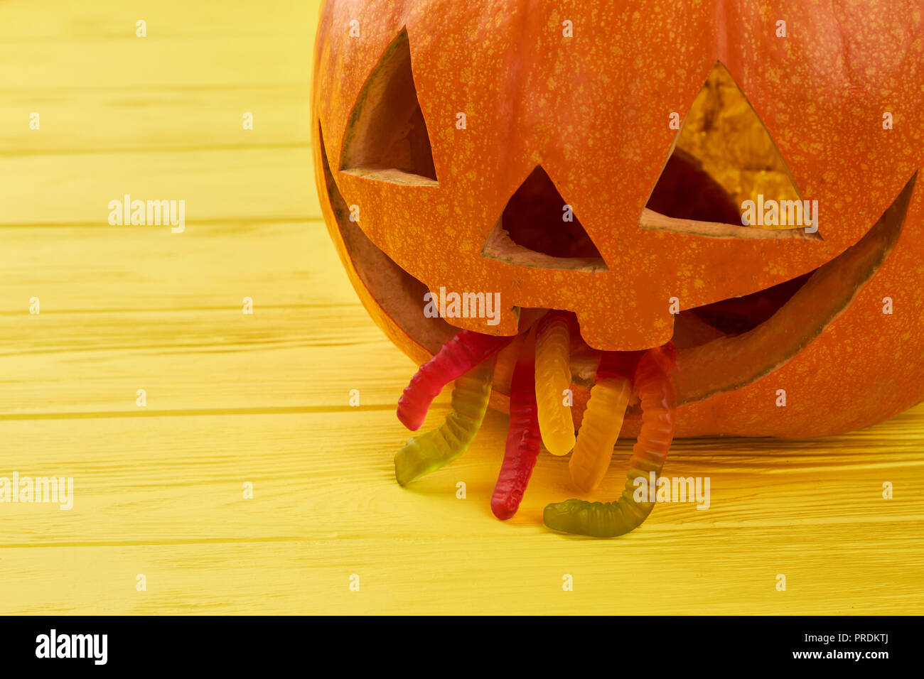 Halloween pumpkin with jelly worms in mouth Stock Photo - Alamy