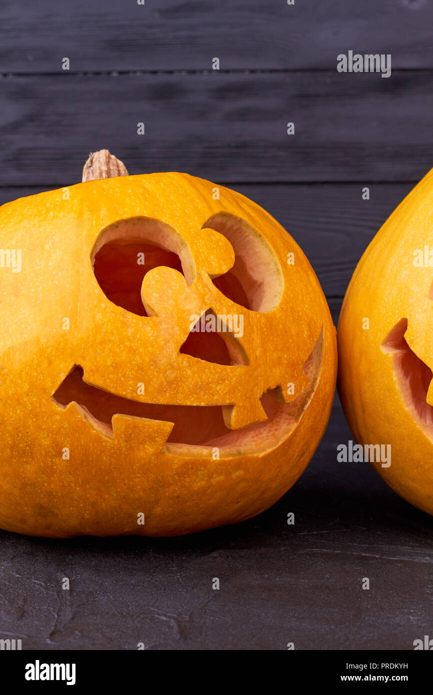 Funny Halloween pumpkin on dark background Stock Photo - Alamy