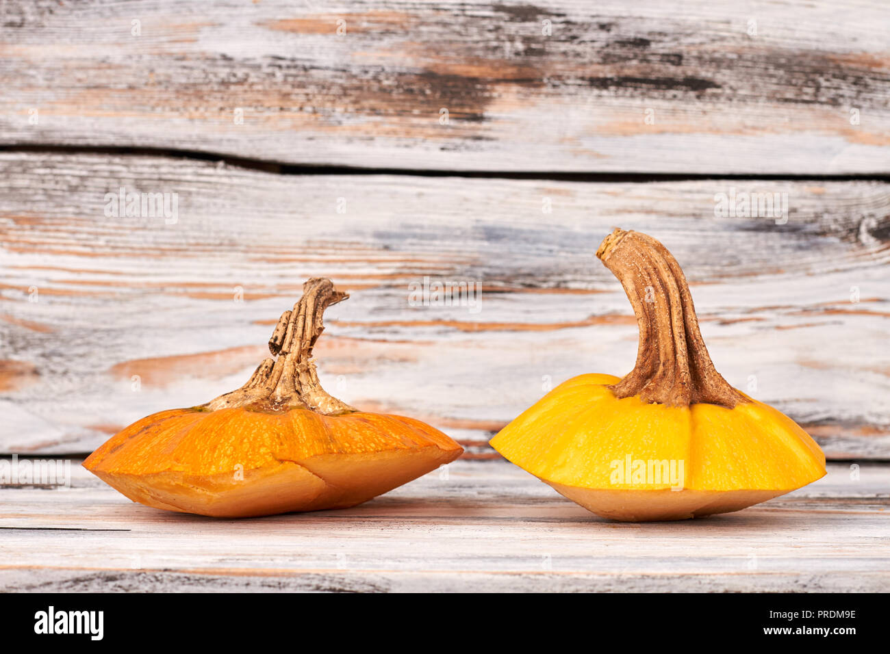 Two stems of orange pumpkins Stock Photo - Alamy