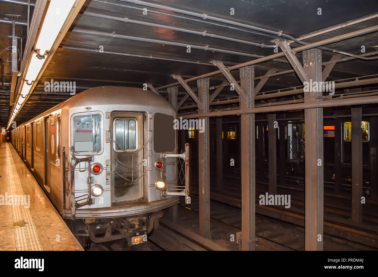 Metro train is arriving to subway platform in Manhattan, New York city ...