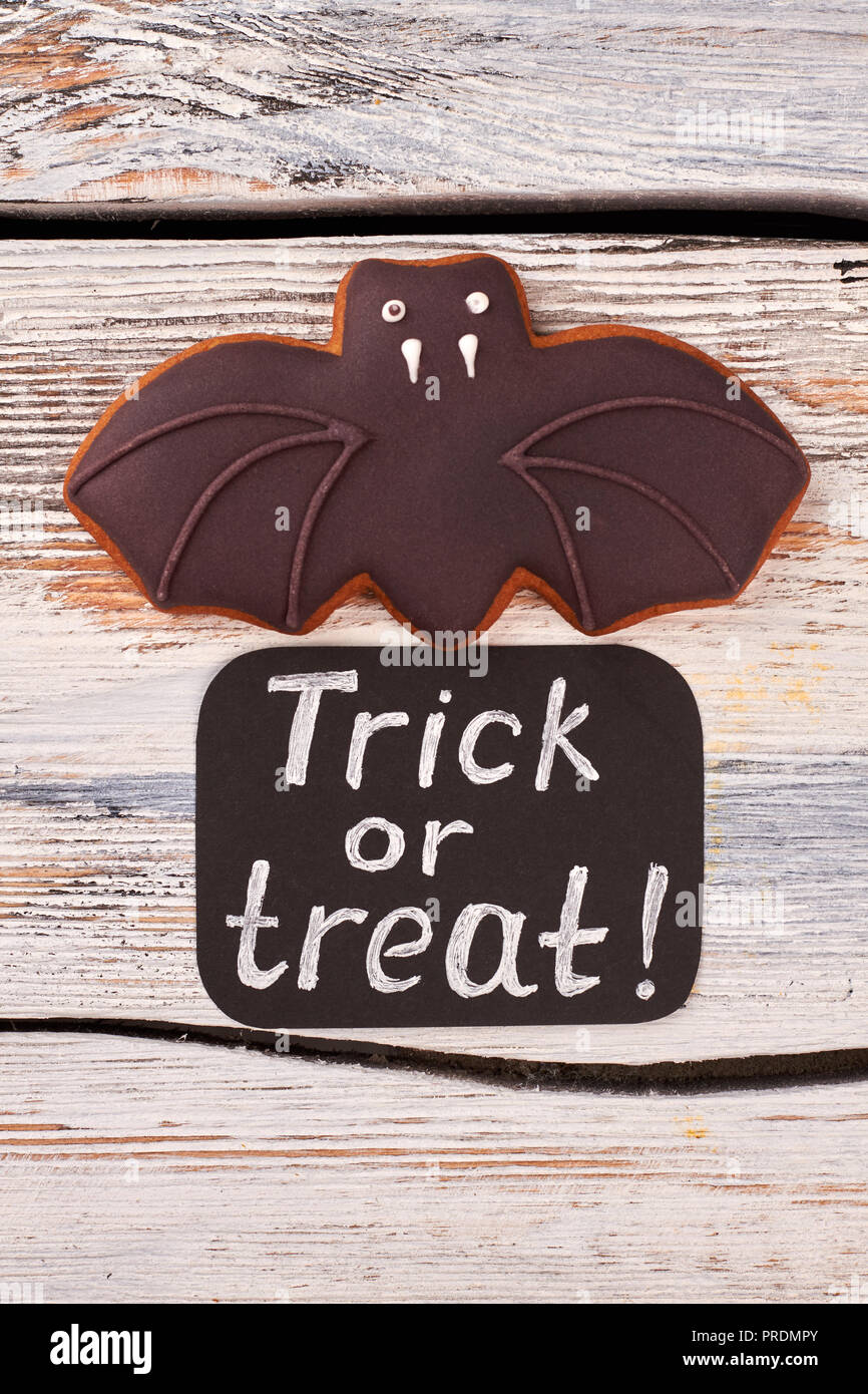 Halloween bat cookie on wooden background Stock Photo - Alamy