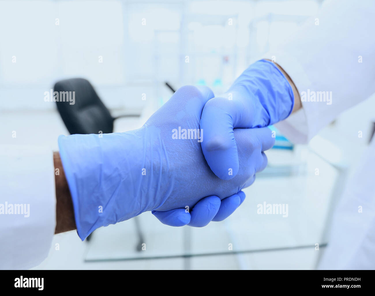hand in the medical glove (handshake Stock Photo - Alamy