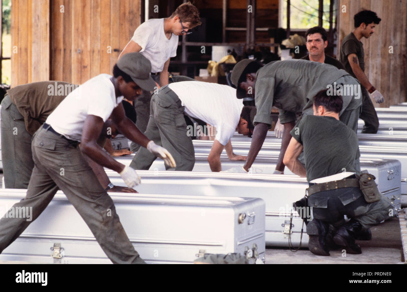 United States military personnel remove American bodies from the cult ...