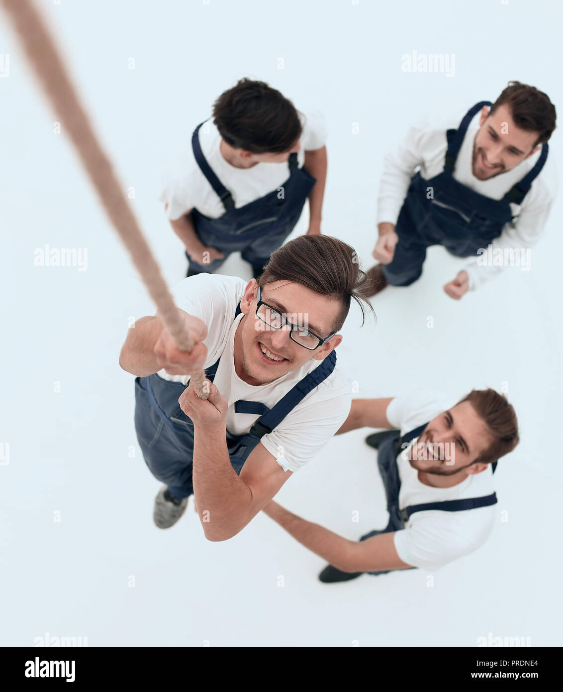 team, helping the leader to climb up the rope Stock Photo - Alamy