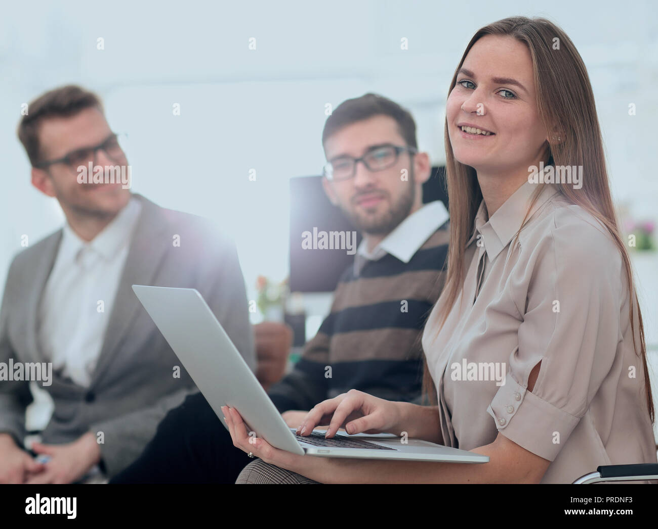 business woman on the background of colleagues Stock Photo - Alamy