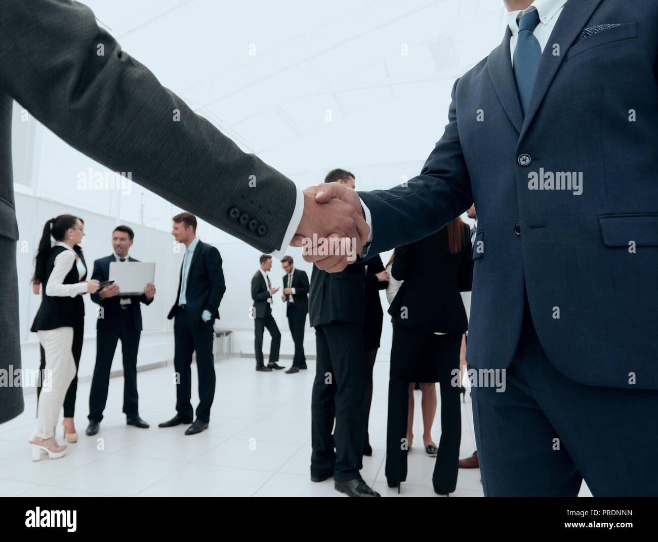 closeup of handshake of business partners on the background of b Stock ...