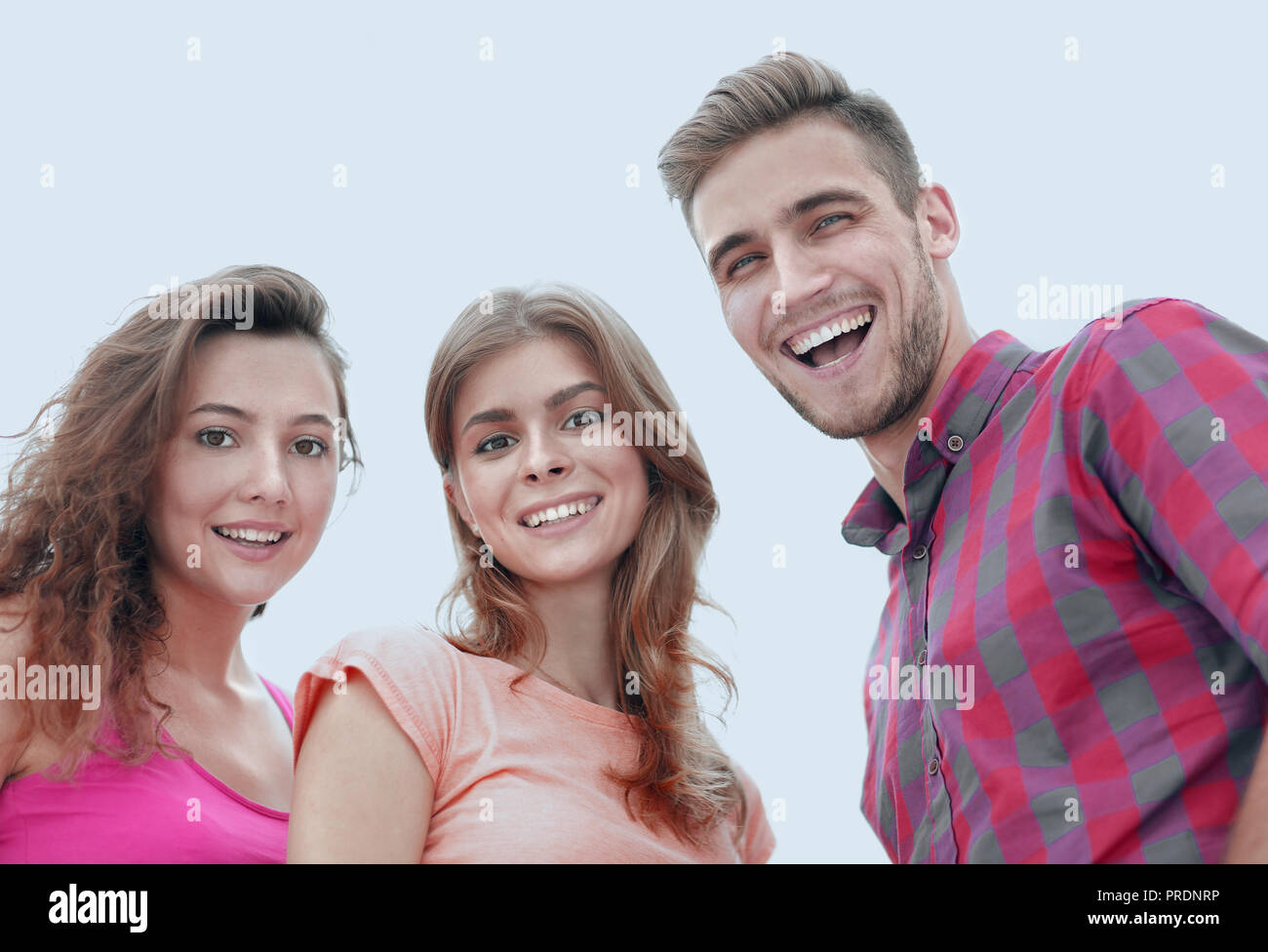 closeup of three young people smiling on white background Stock Photo ...