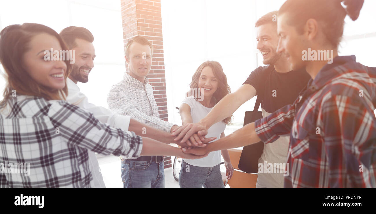Business Team putting their hands together Stock Photo - Alamy