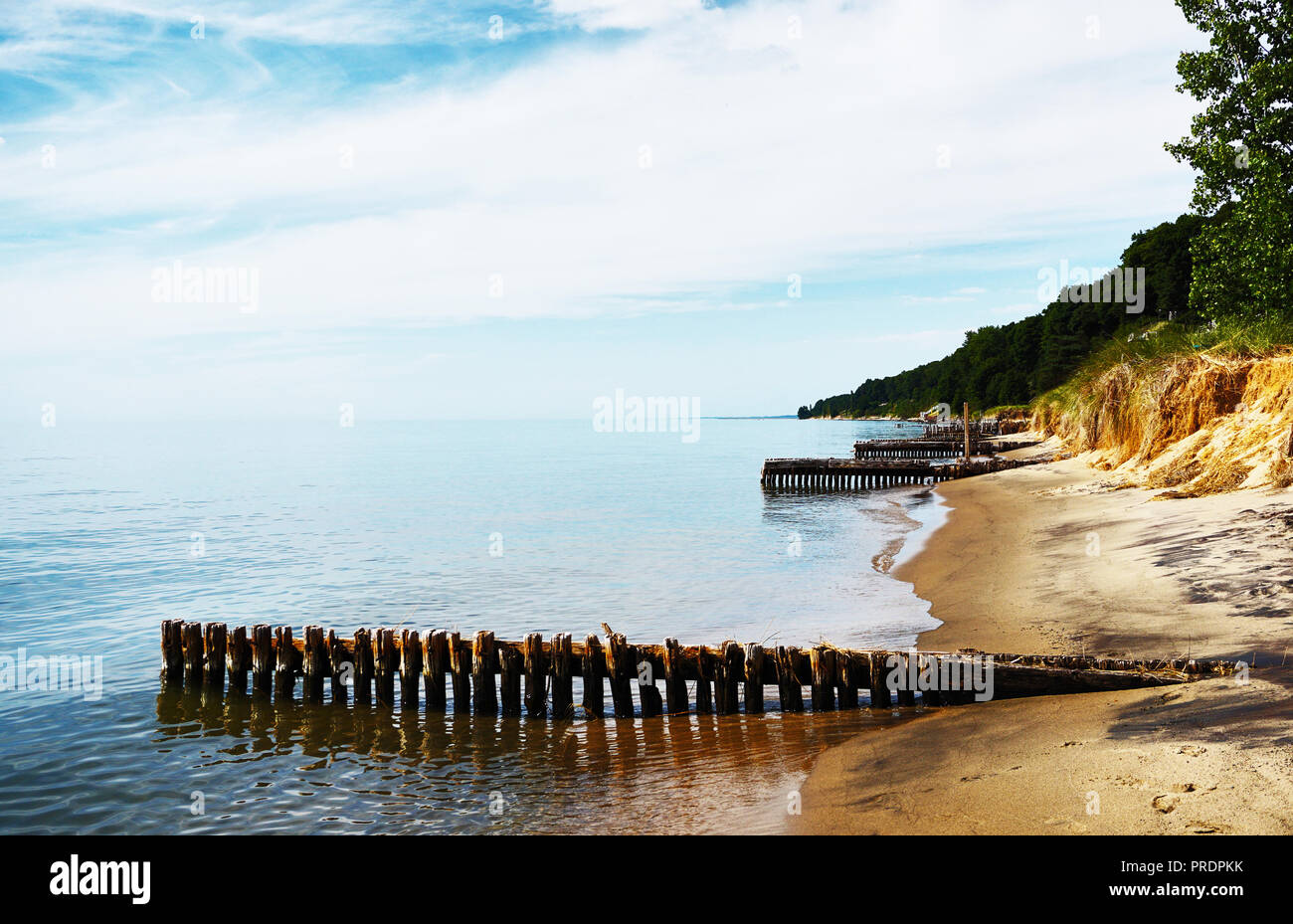 Piles of Old Piers in the Bay on Lake Michigan Beach. Sandy Shoreline ...