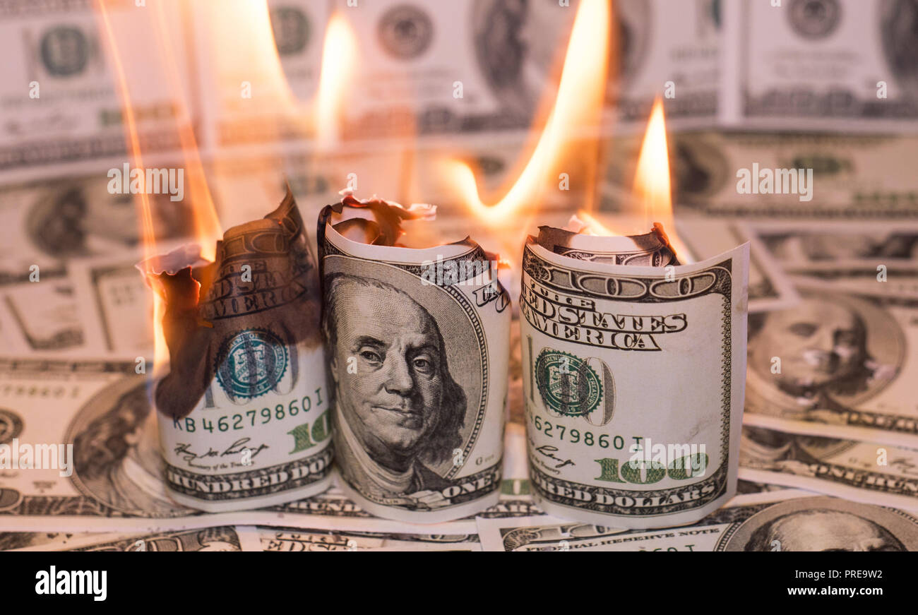 A hunred dollar bill in American US currency is on fire Stock Photo - Alamy