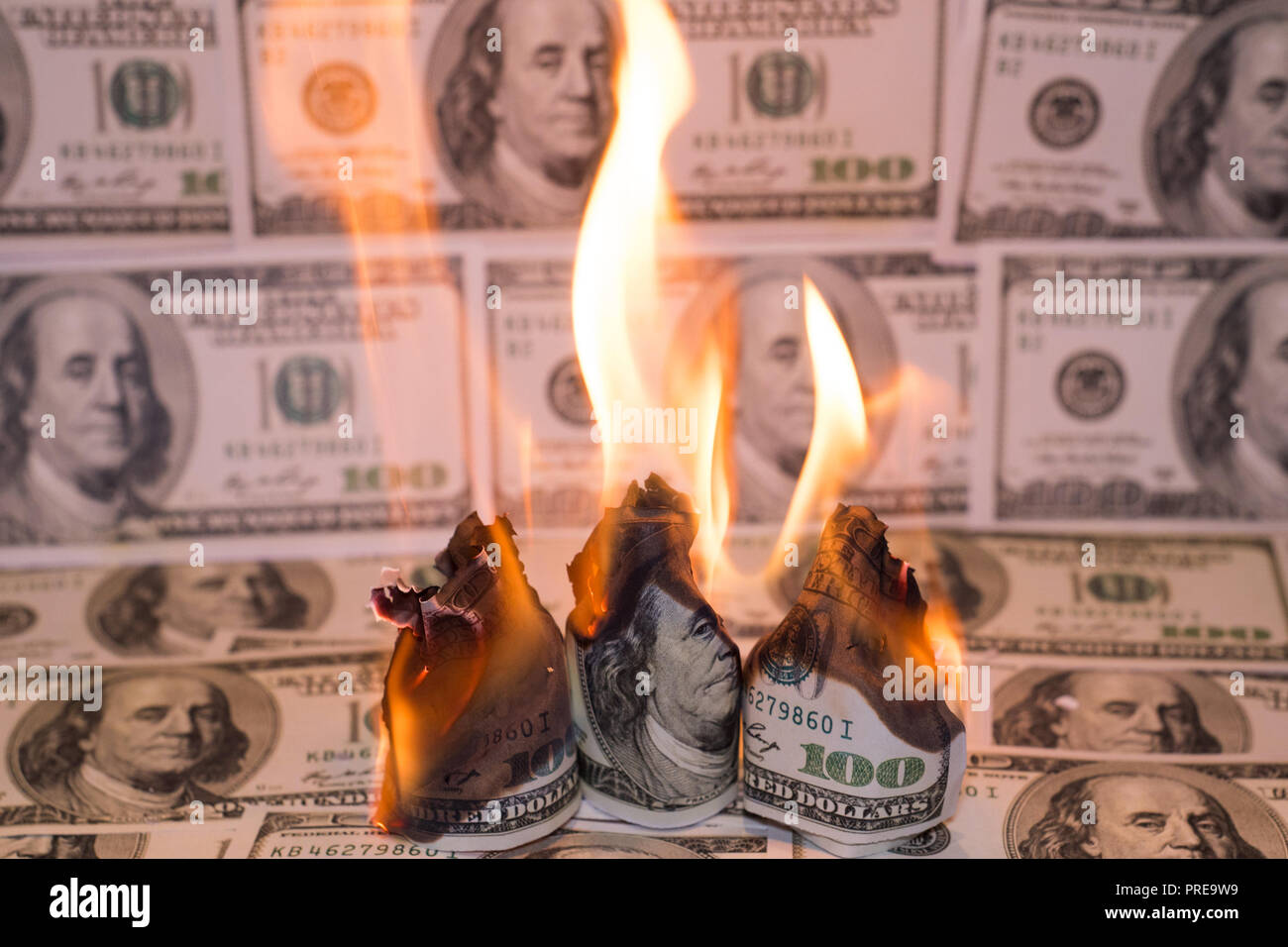 A hunred dollar bill in American US currency is on fire Stock Photo - Alamy