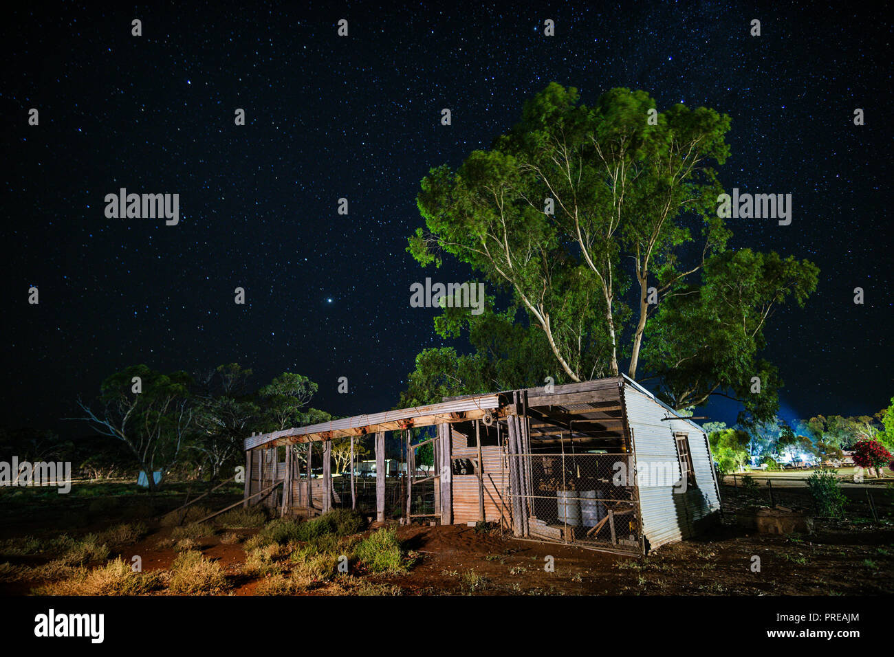 Abandoned shearing shed under starry night sky at Fraser Range Station ...