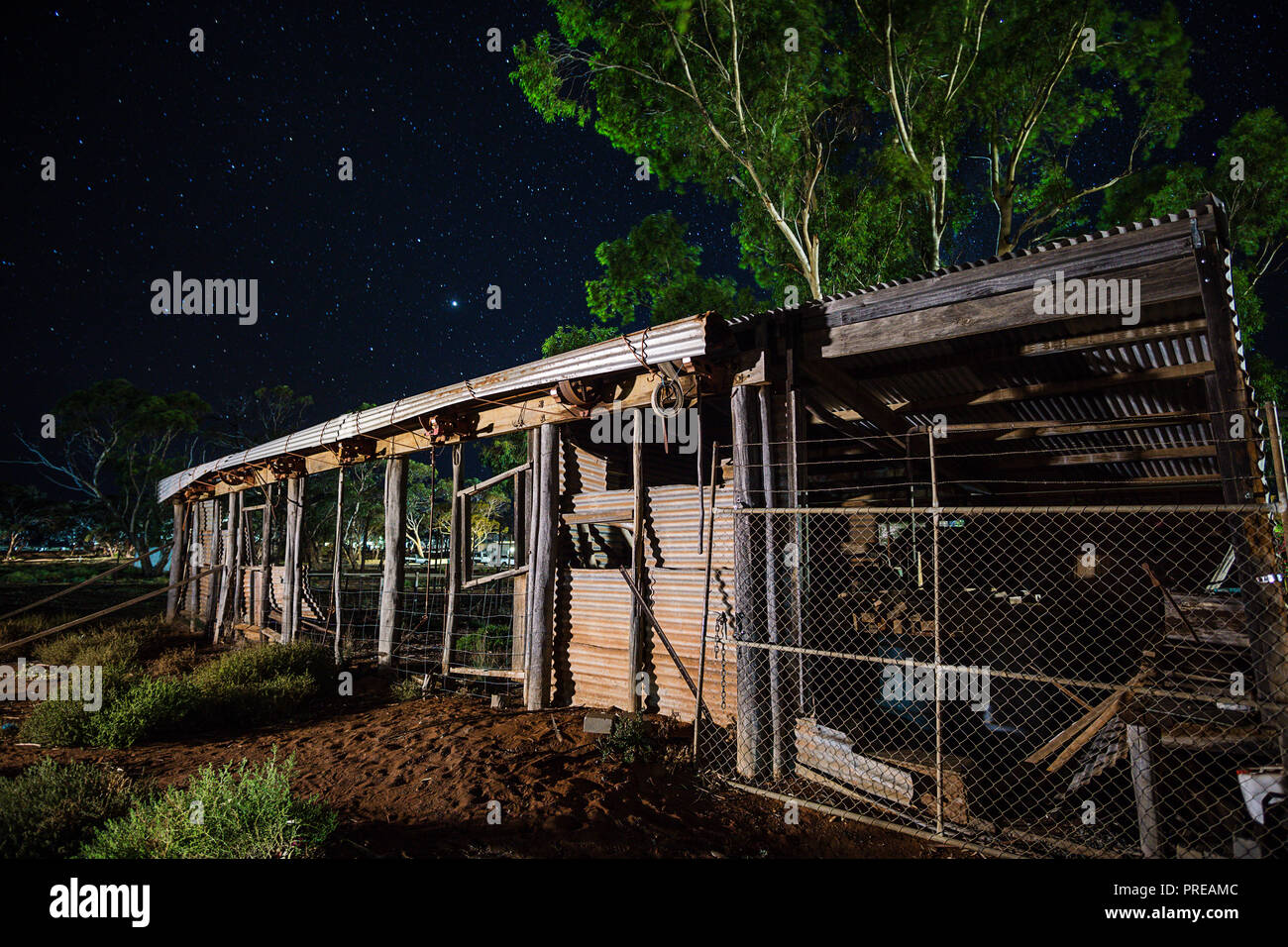 Abandoned shearing shed under starry night sky at Fraser Range Station ...