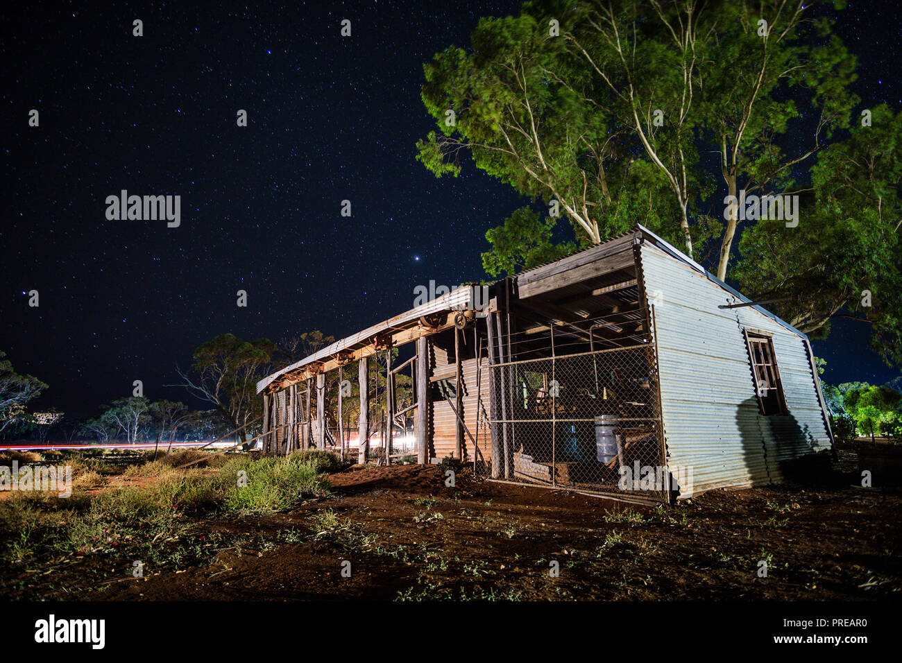 Abandoned shearing shed under starry night sky at Fraser Range Station ...