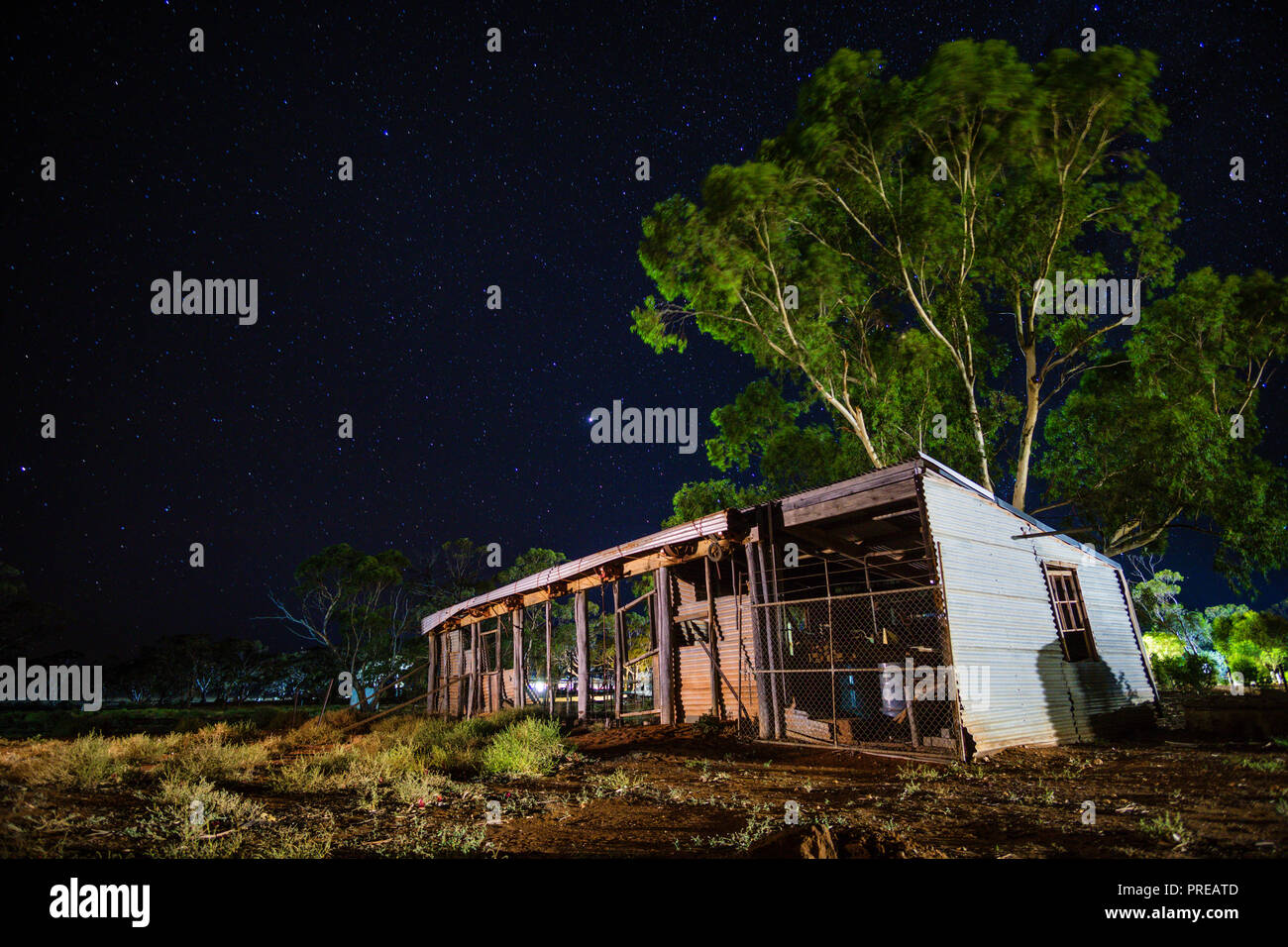 Abandoned shearing shed under starry night sky at Fraser Range Station ...