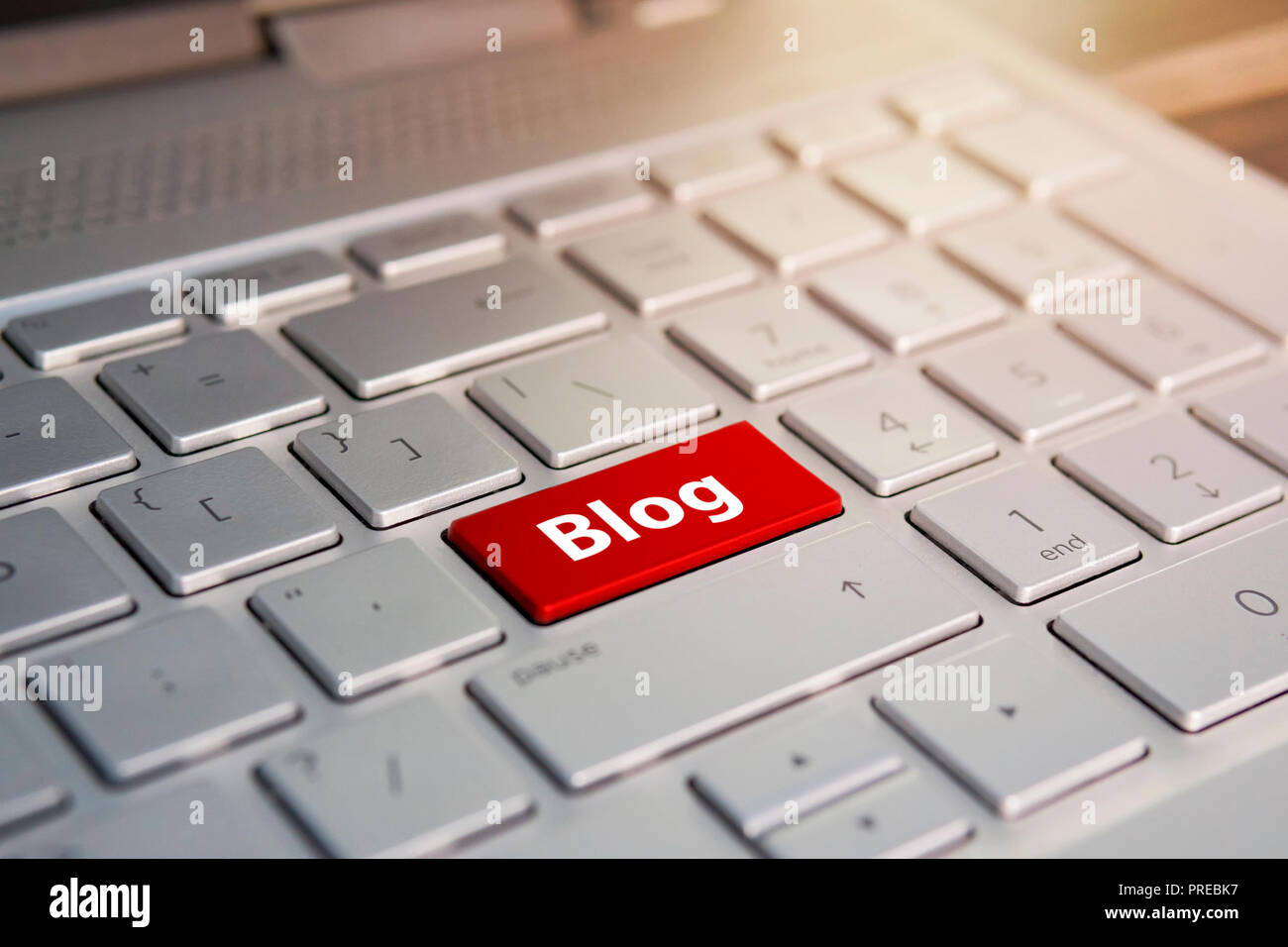 Keyboard close up. Blog concept. Color button on the gray silver ...