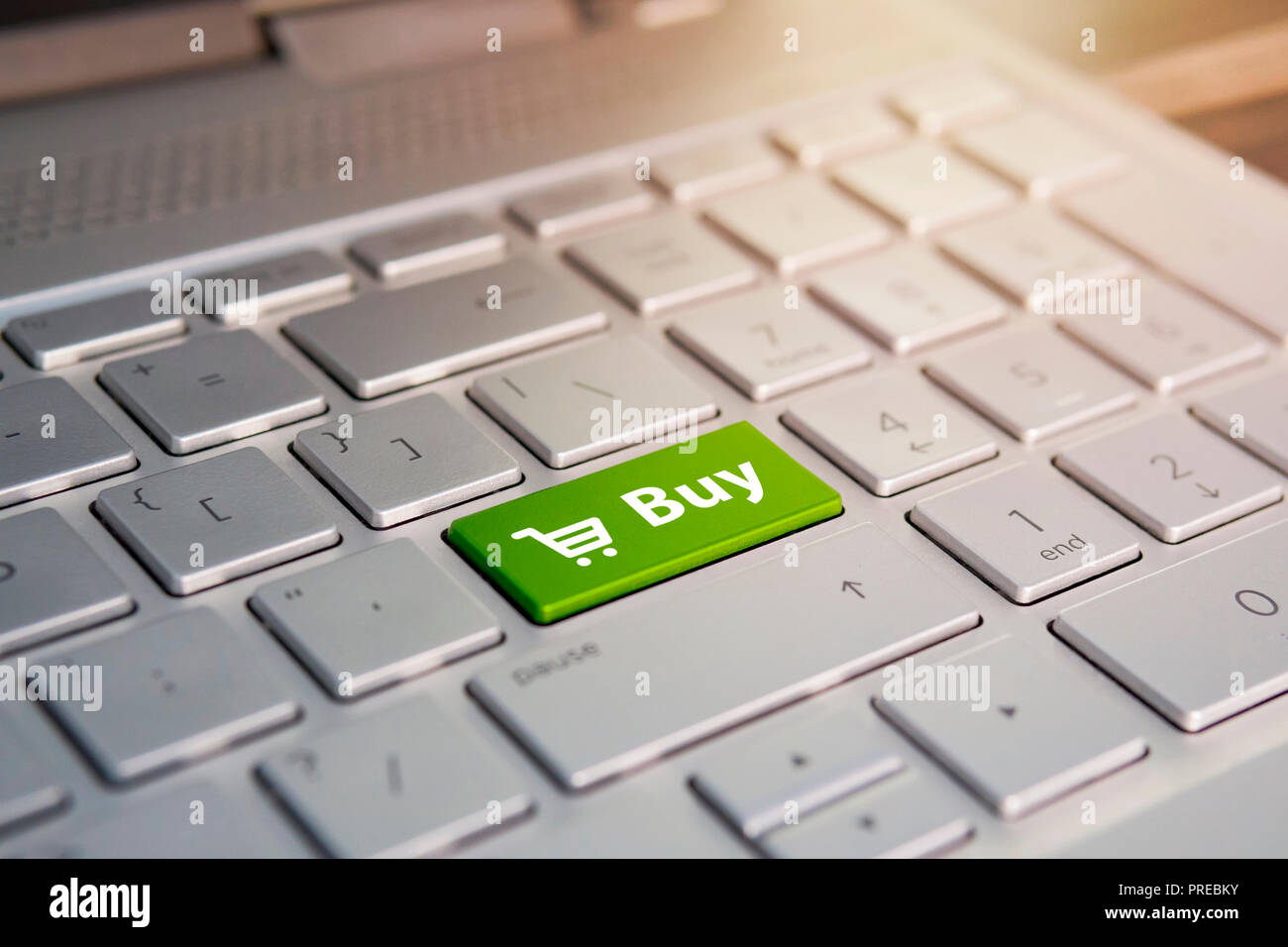 shopping enter button key on white keyboard. Color button on the gray ...