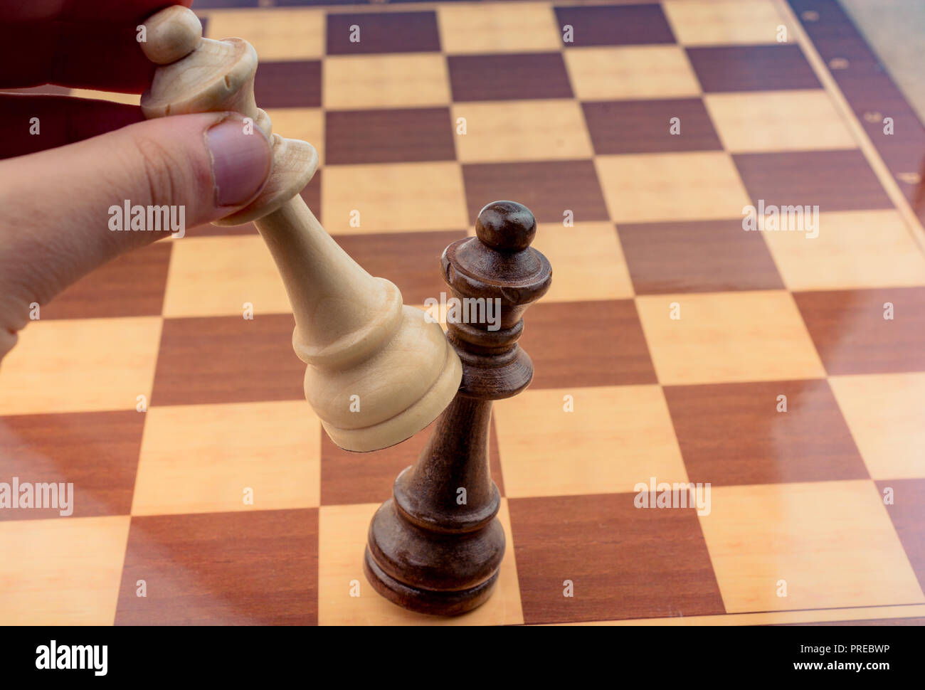 Person playing chess game making a move on board Stock Photo - Alamy