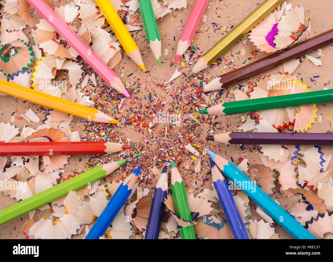 Color Pencils over a notebook with pencil shavings Stock Photo - Alamy
