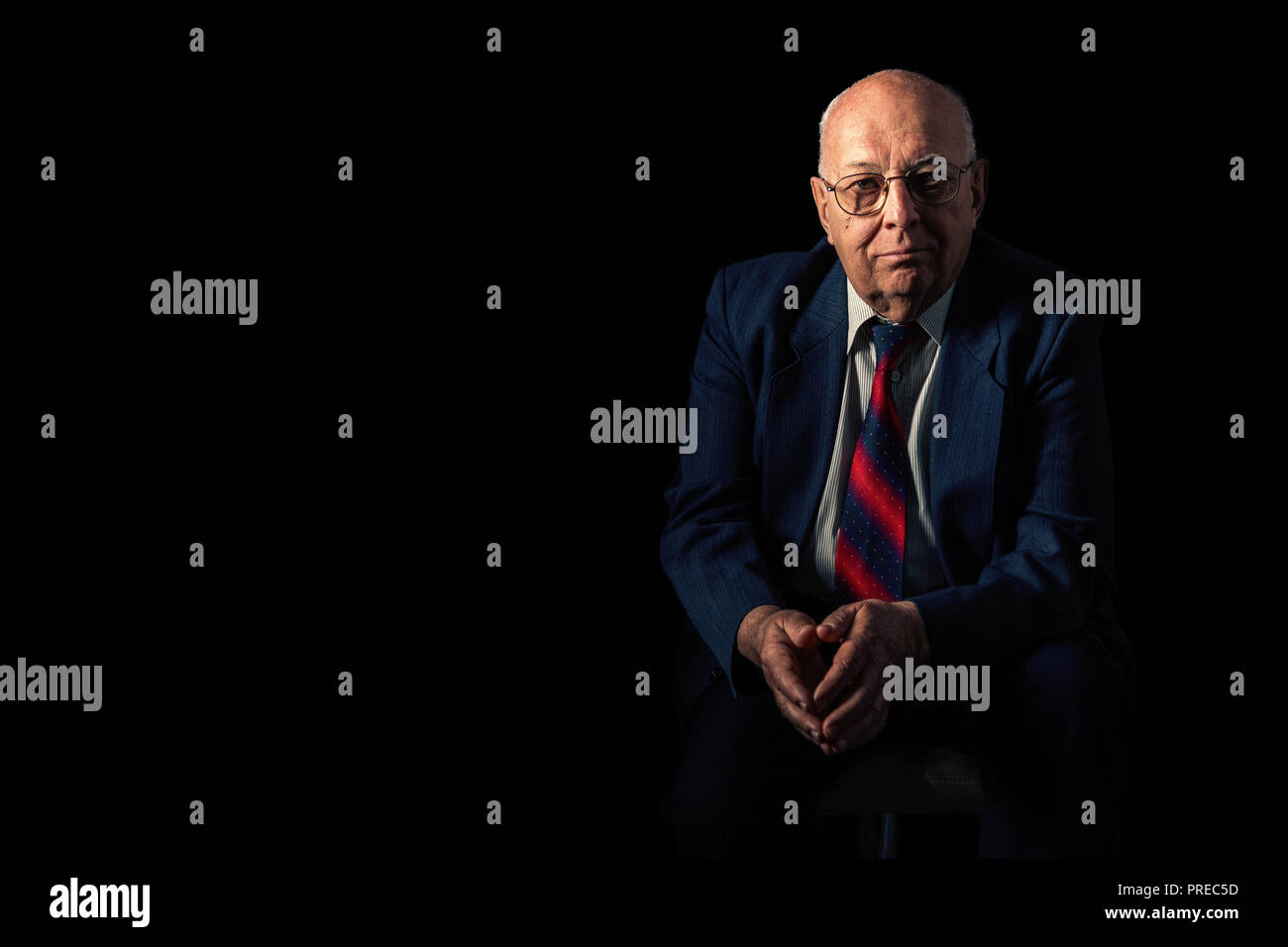 Old businessman dark edition. copy space Stock Photo - Alamy
