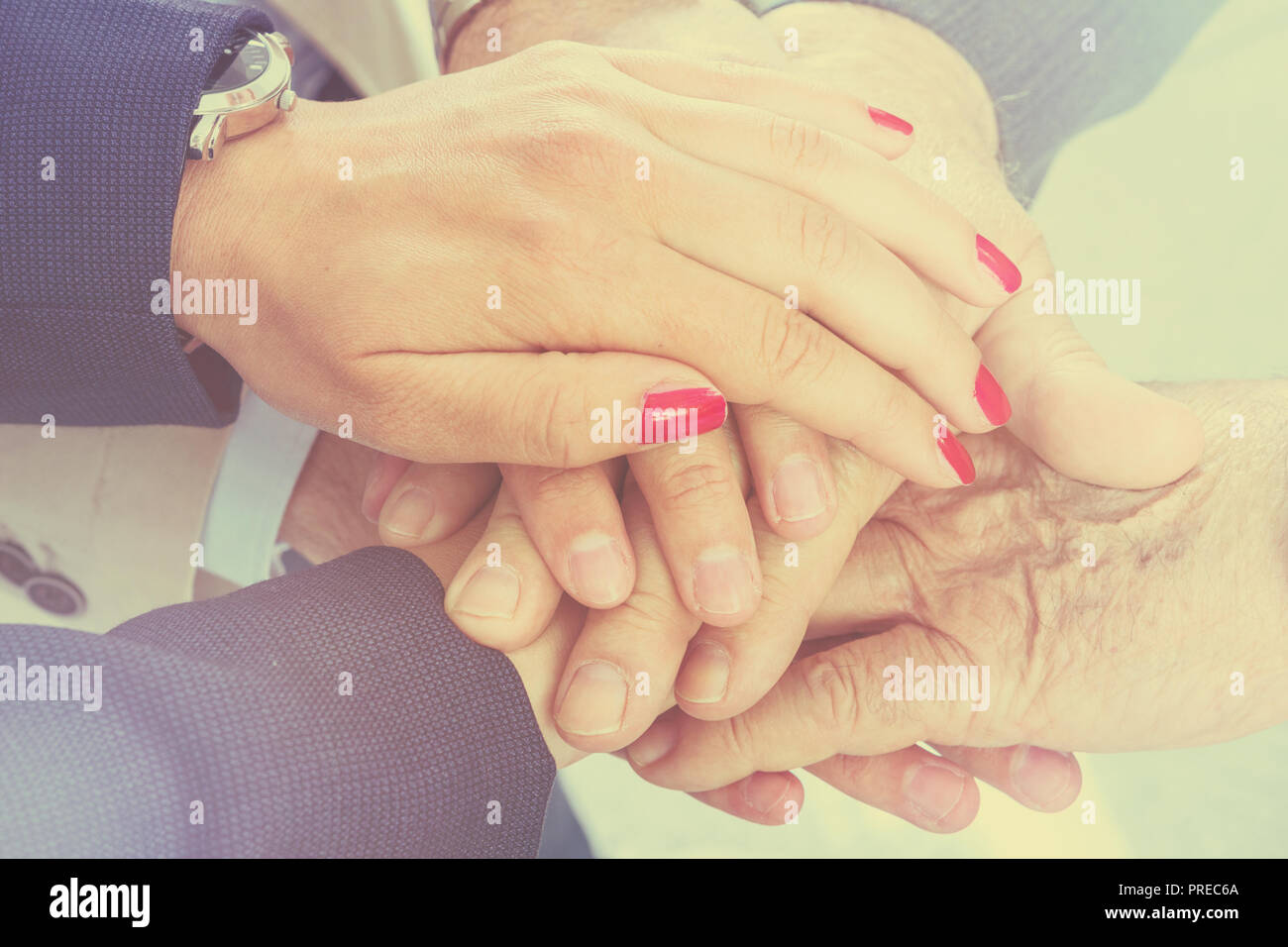 Business people putting their hands together. Arms consolidation ...