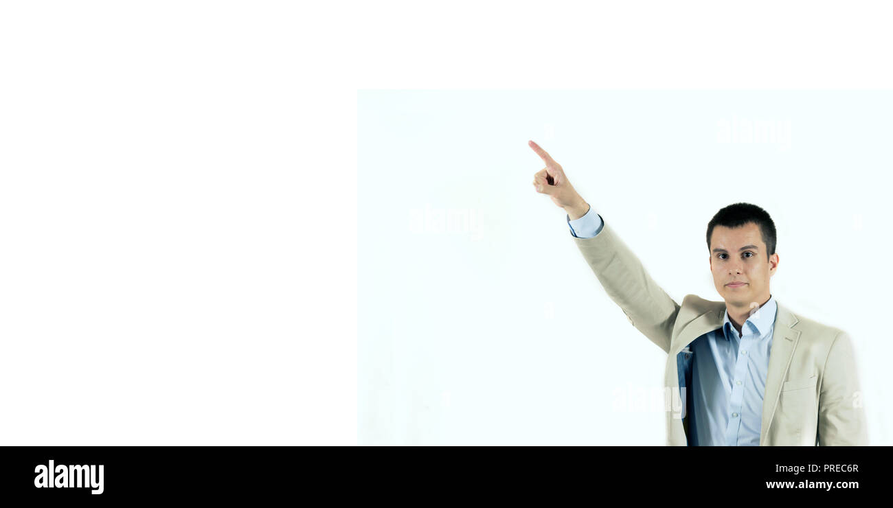 Young Businessman pointing copy space. Handsome young man looking at ...