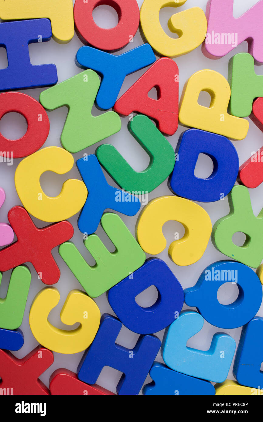 Colorful alphabet letter blocks scattered randomly on white background ...
