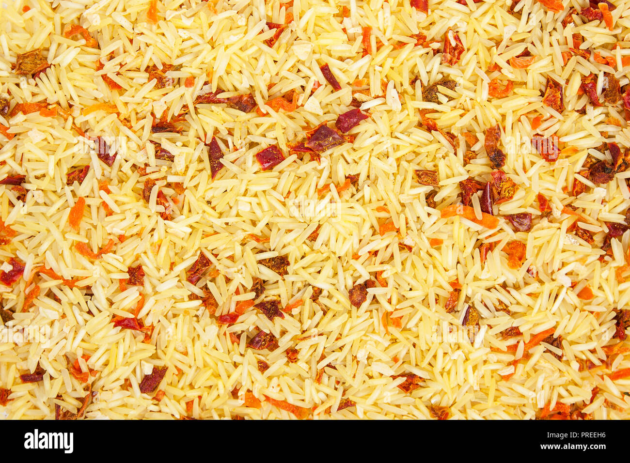 Background texture of basmati rice with dried vegetables. Top view ...