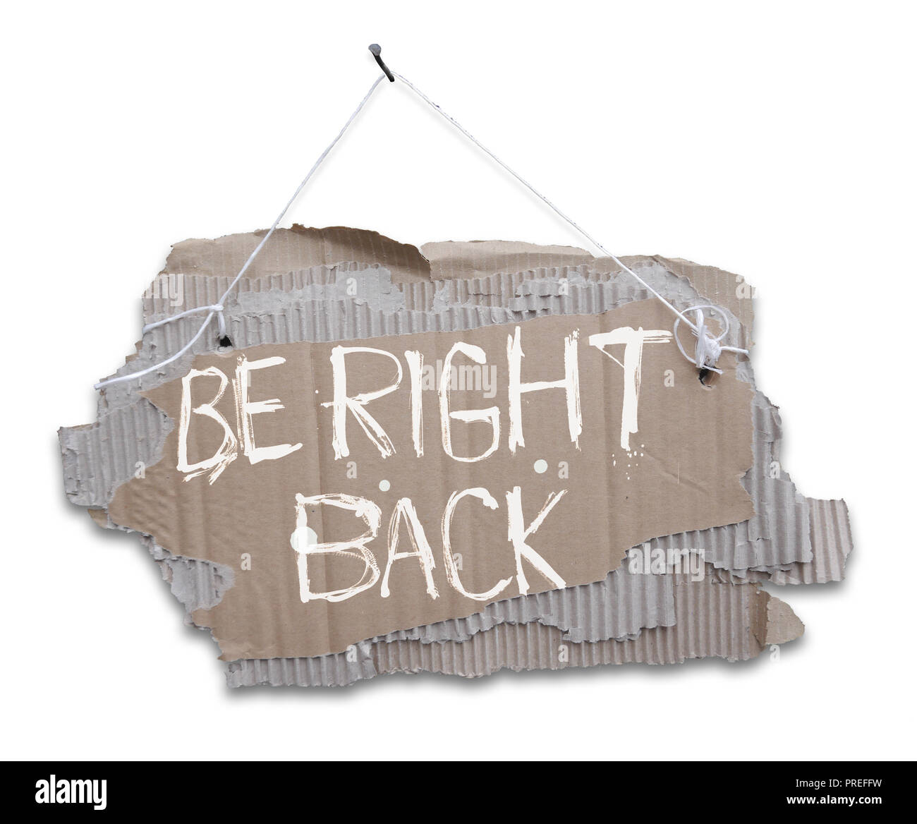 Cardboard sign on a cord with a words BE RIGHT BACK. Ripped, corrugated ...