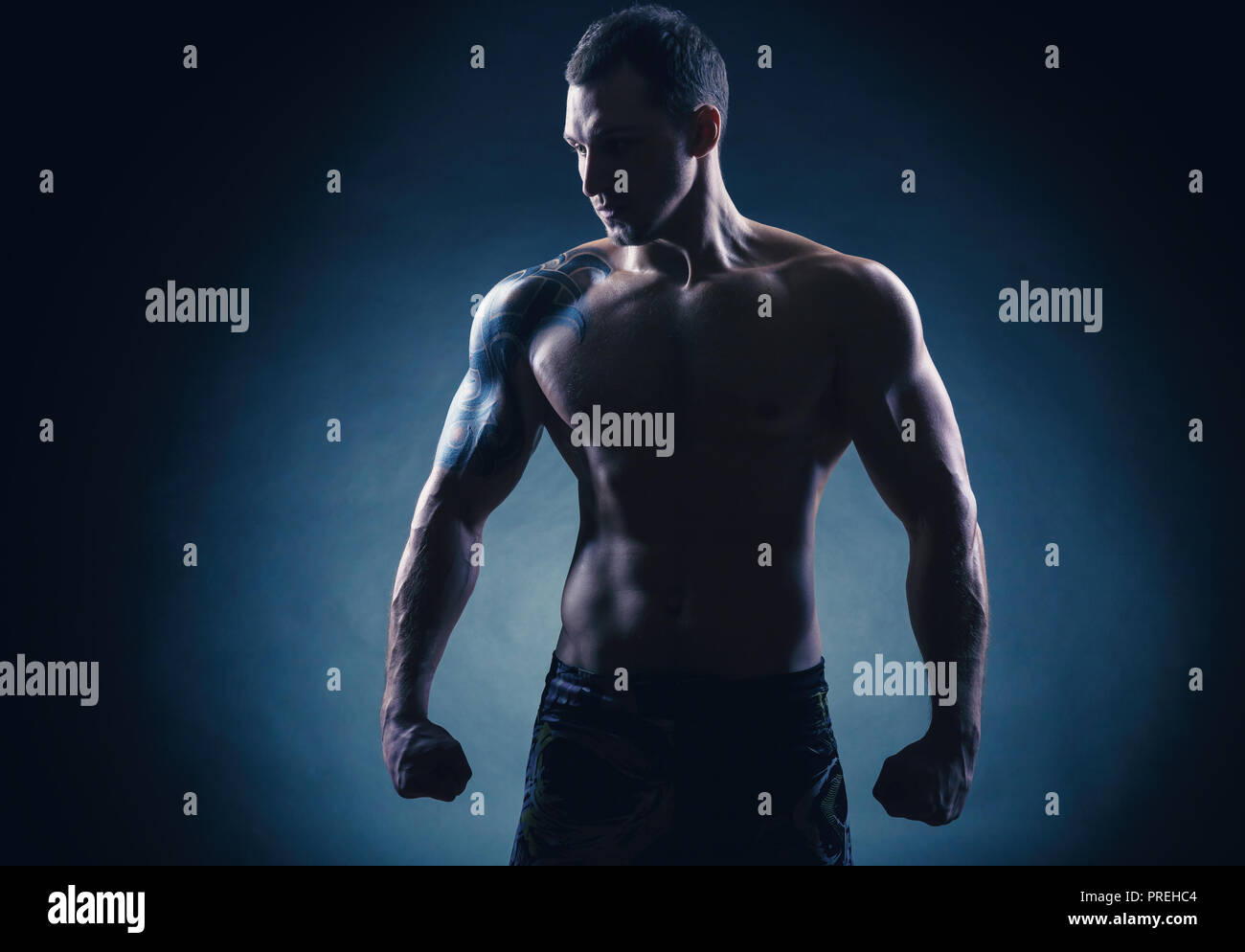 Man boxing. Young boxer fighter over black background Stock Photo - Alamy