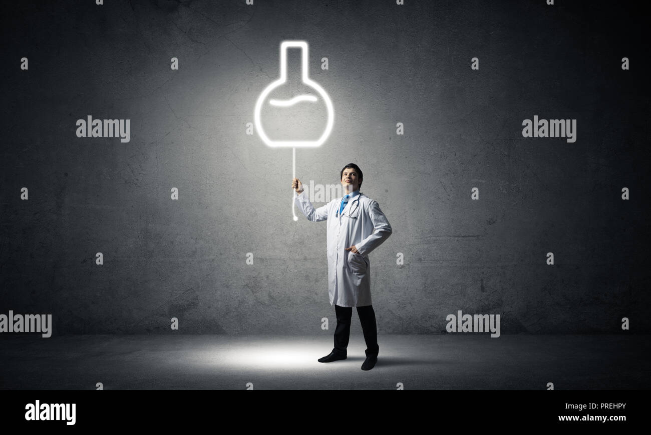 Doctor and vial symbol Stock Photo - Alamy