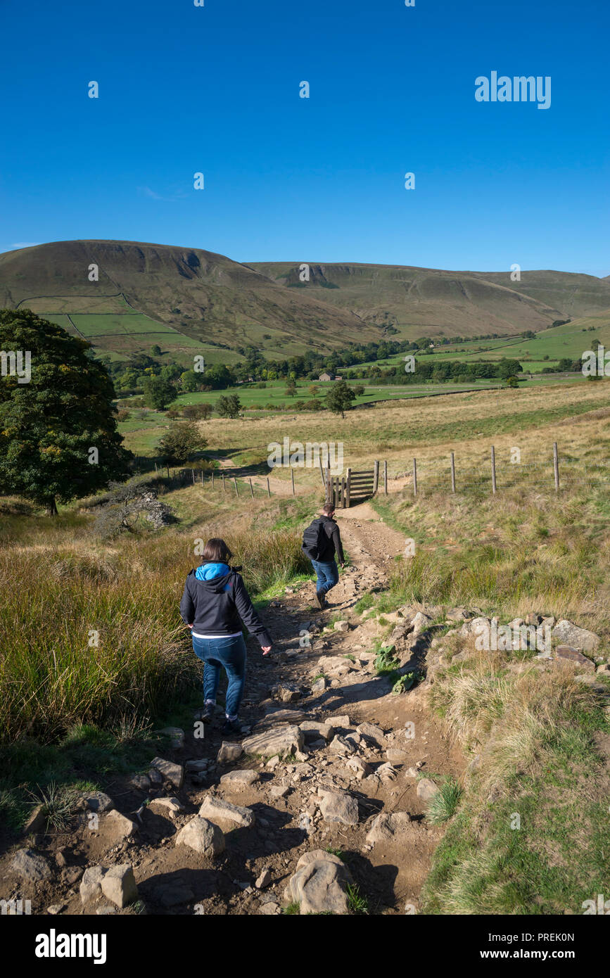 Young couple walking the Pennine Way footpath between Edale and Barber ...