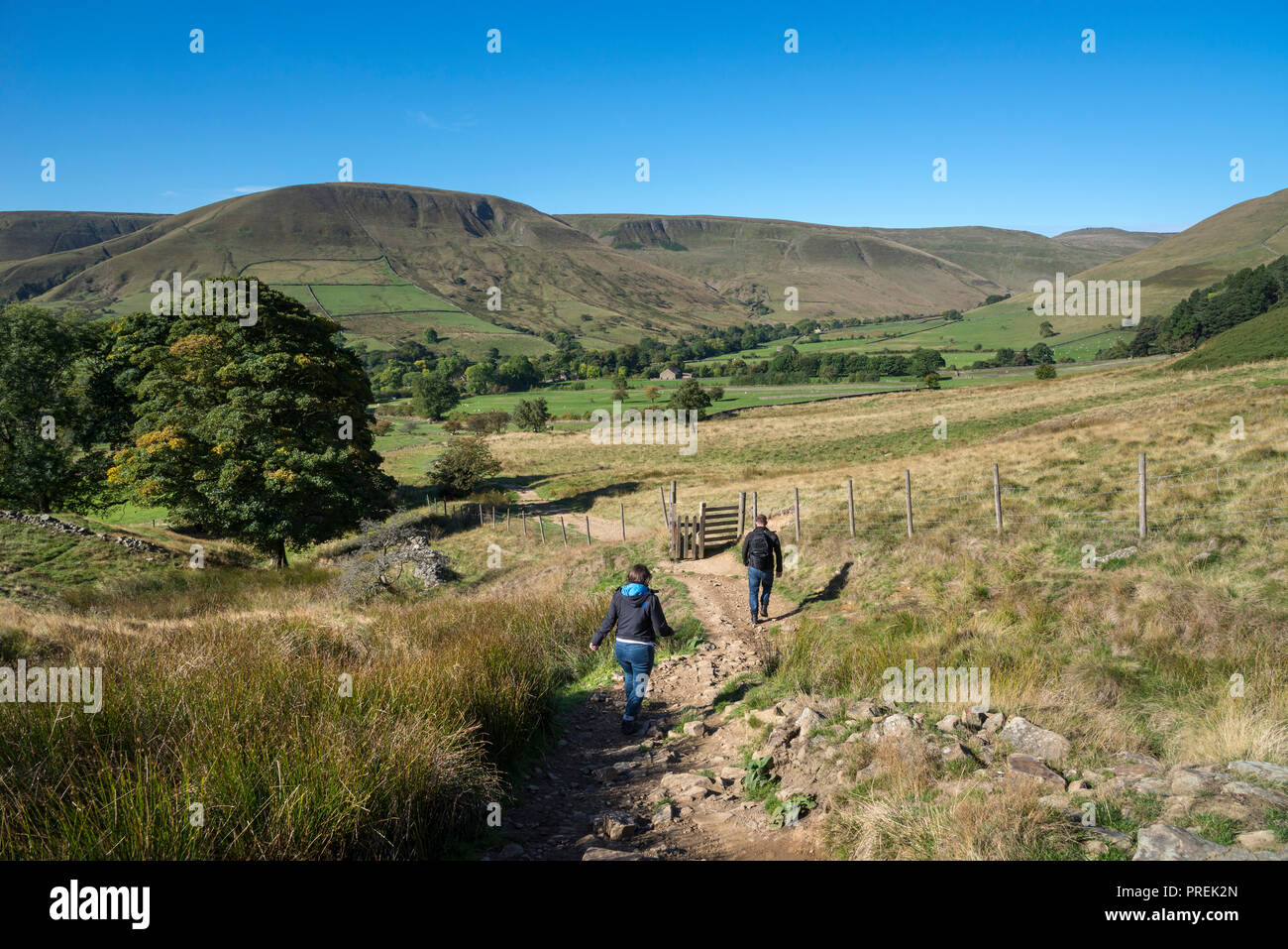 Young couple walking the Pennine Way footpath between Edale and Barber ...
