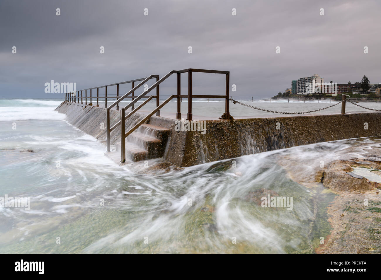 Flowing waves over an ocean swimming pool Stock Photo - Alamy