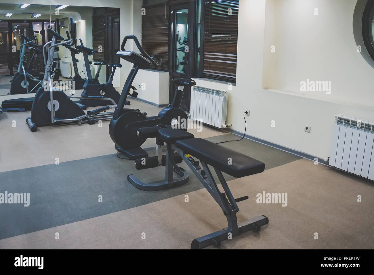 Interior of a fitness hall. Various gyms for sports in a small home gym ...