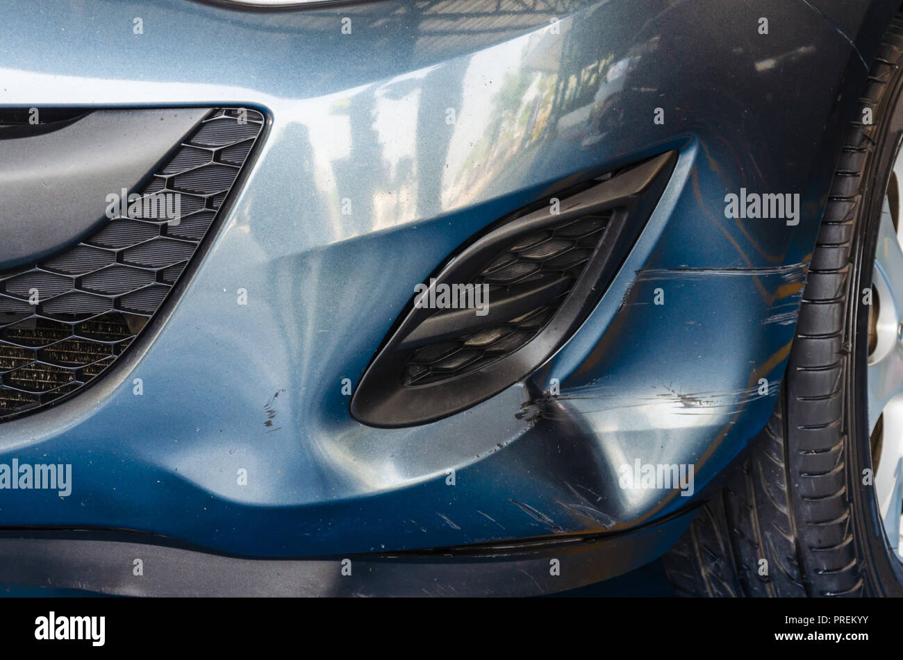 Front bumper dented car accident Stock Photo - Alamy