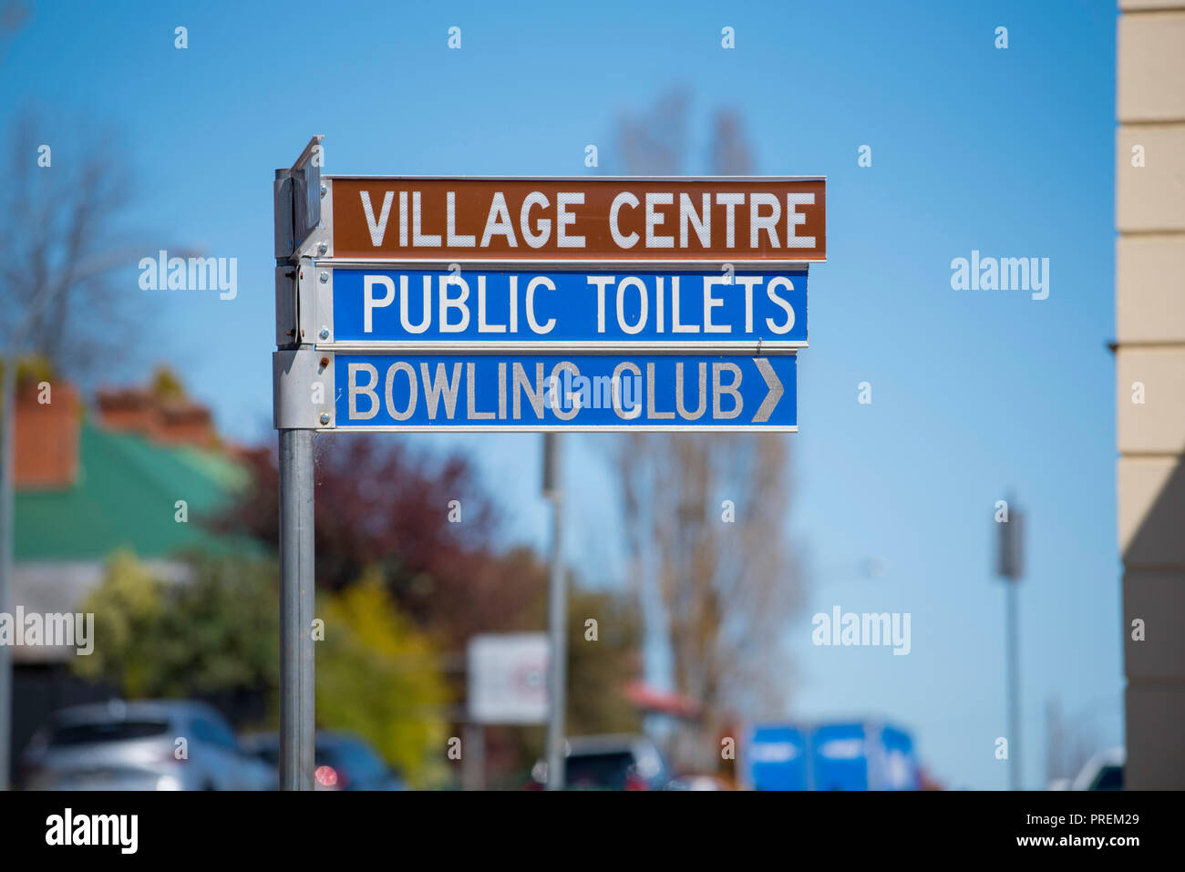 multiple signs on the one sign post in the historic village of ...