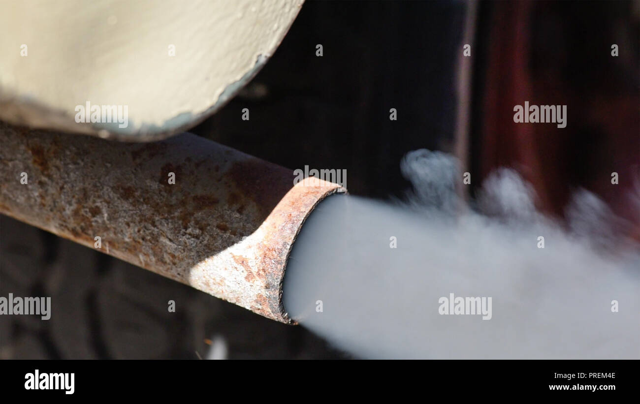 smoke emissions pouring from vehicle exhaust uk Stock Photo - Alamy