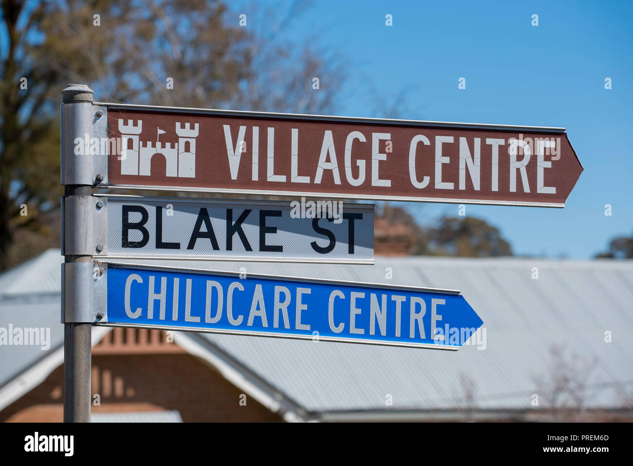 multiple signs on the one sign post in the historic village of ...