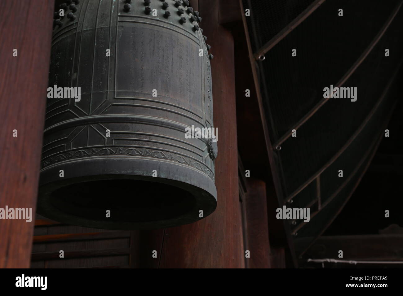 Giant Bell at Zenpon Temple, Japan. With Wooden architecture above head ...