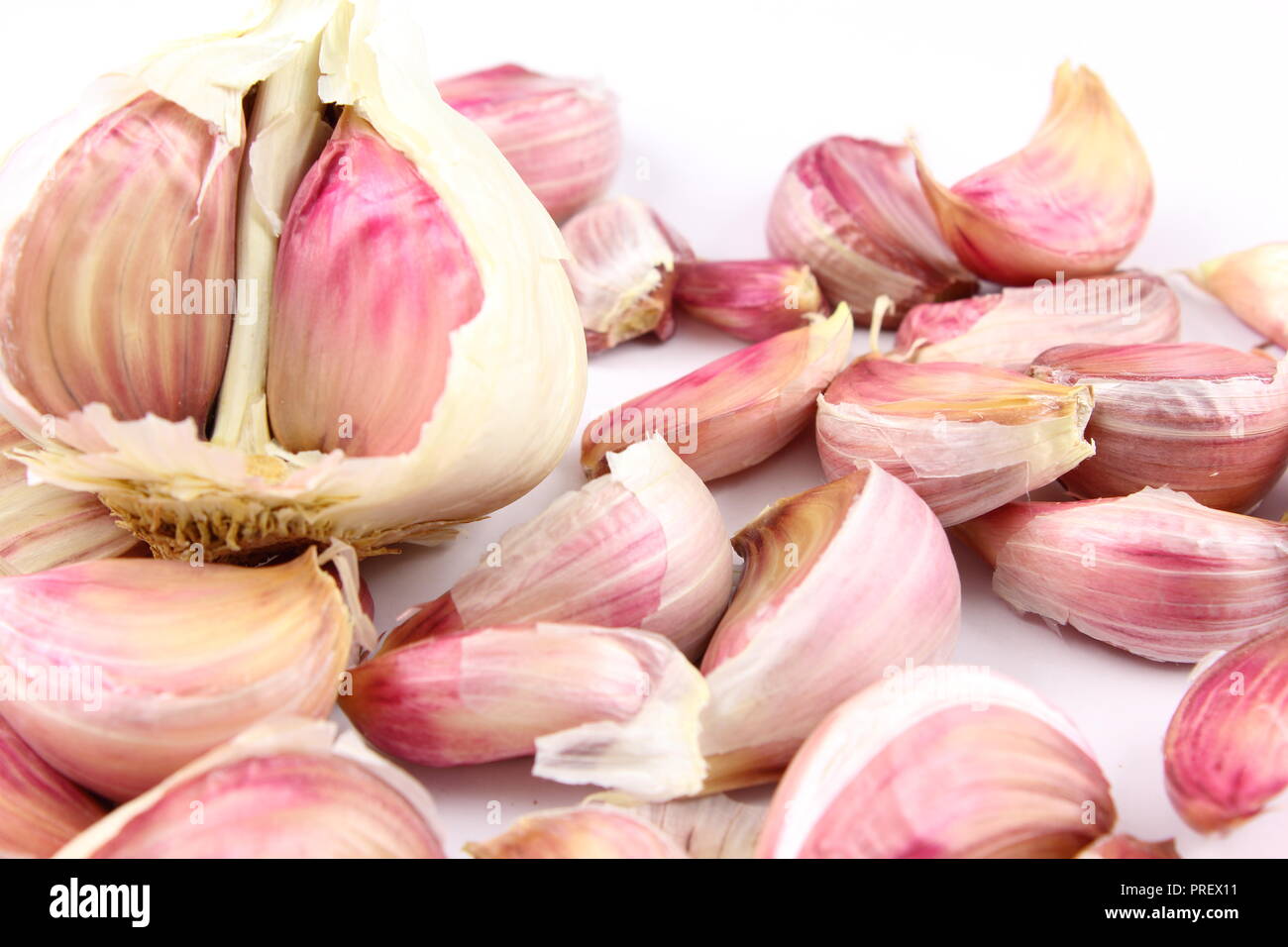 composition of garlic cloves on a white background Stock Photo - Alamy