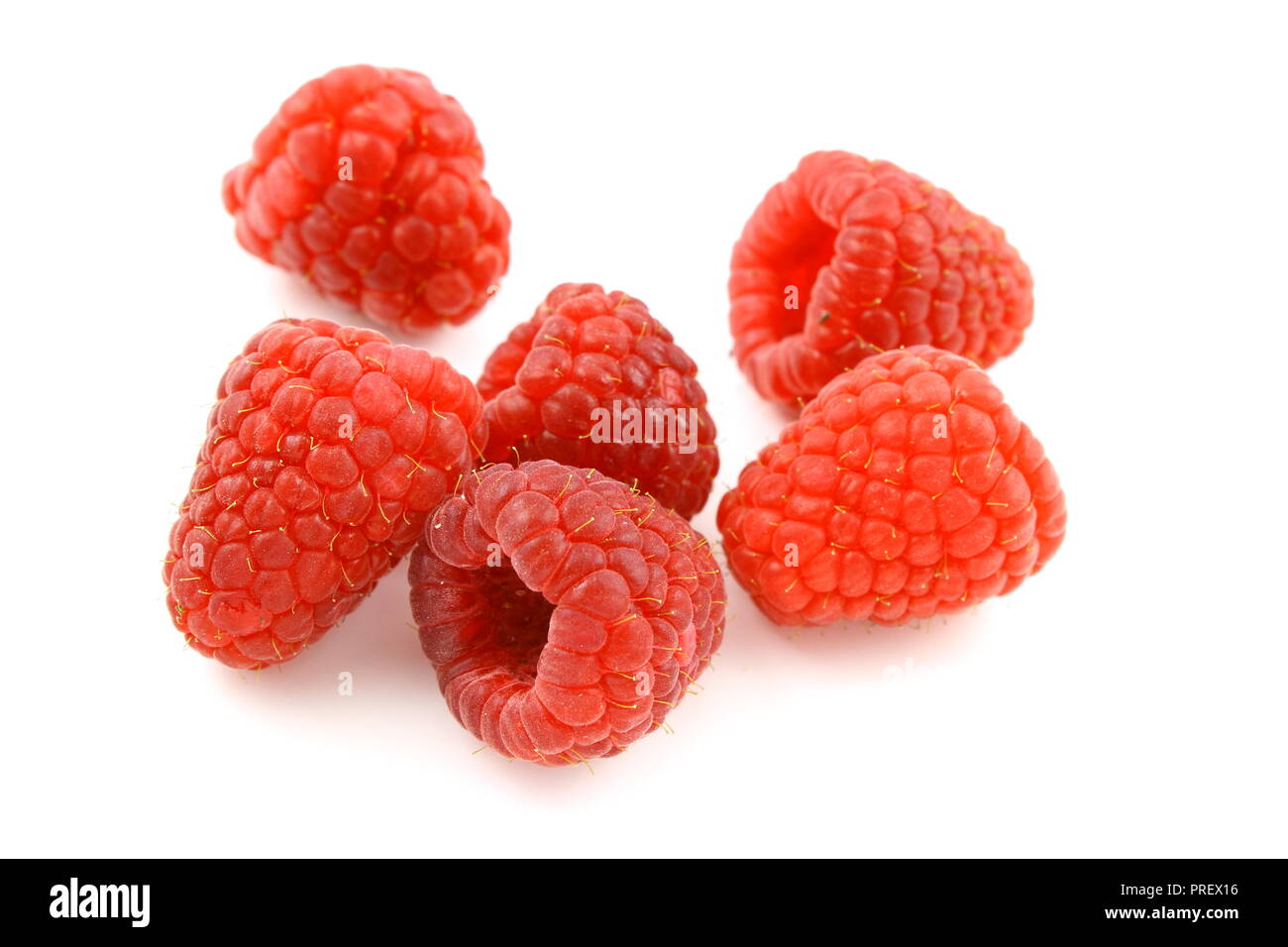 composition of fresh red raspberry fruits isolated on a white ...
