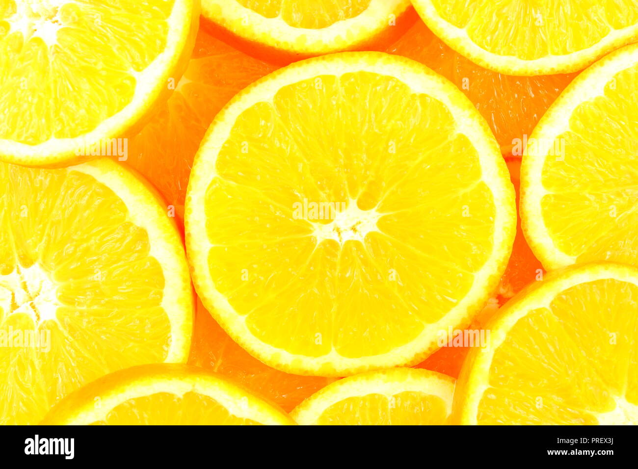 slices of fresh orange fruits as a food background texture Stock Photo ...