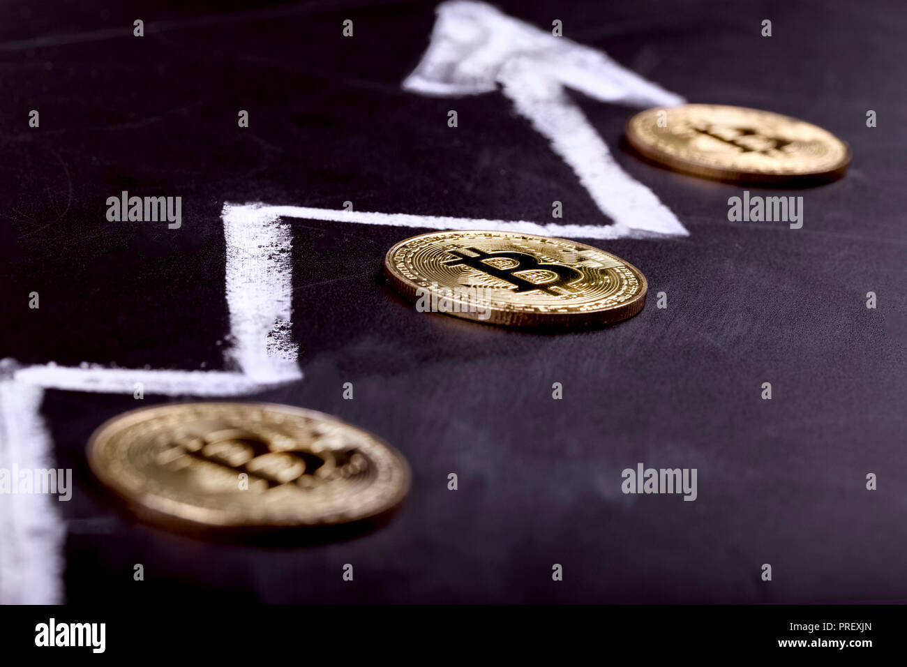 bitcoin and graph with increasing dynamics on chalkboard, background ...