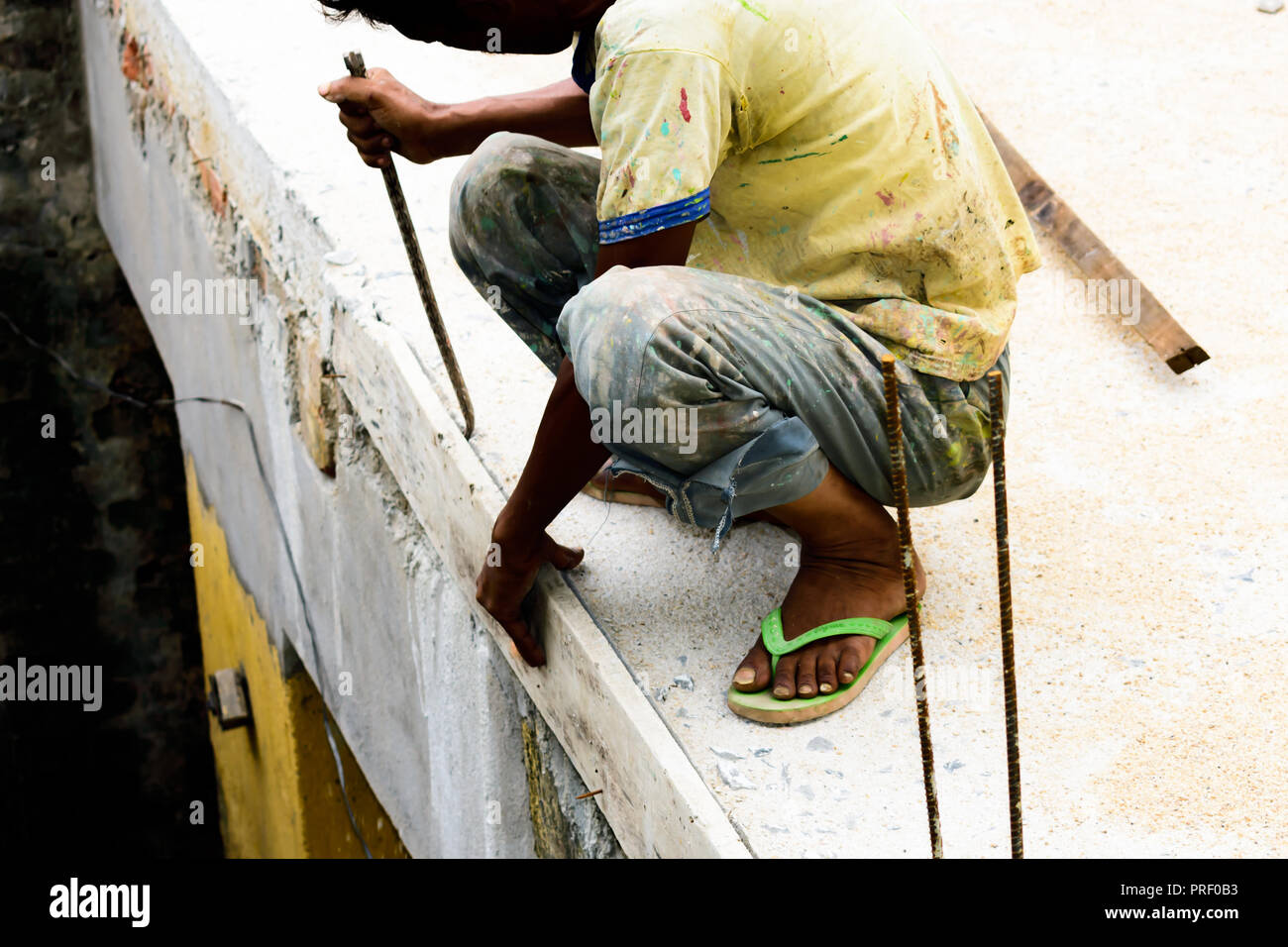 industrial worker, bricklayer, mason working on construction site with ...
