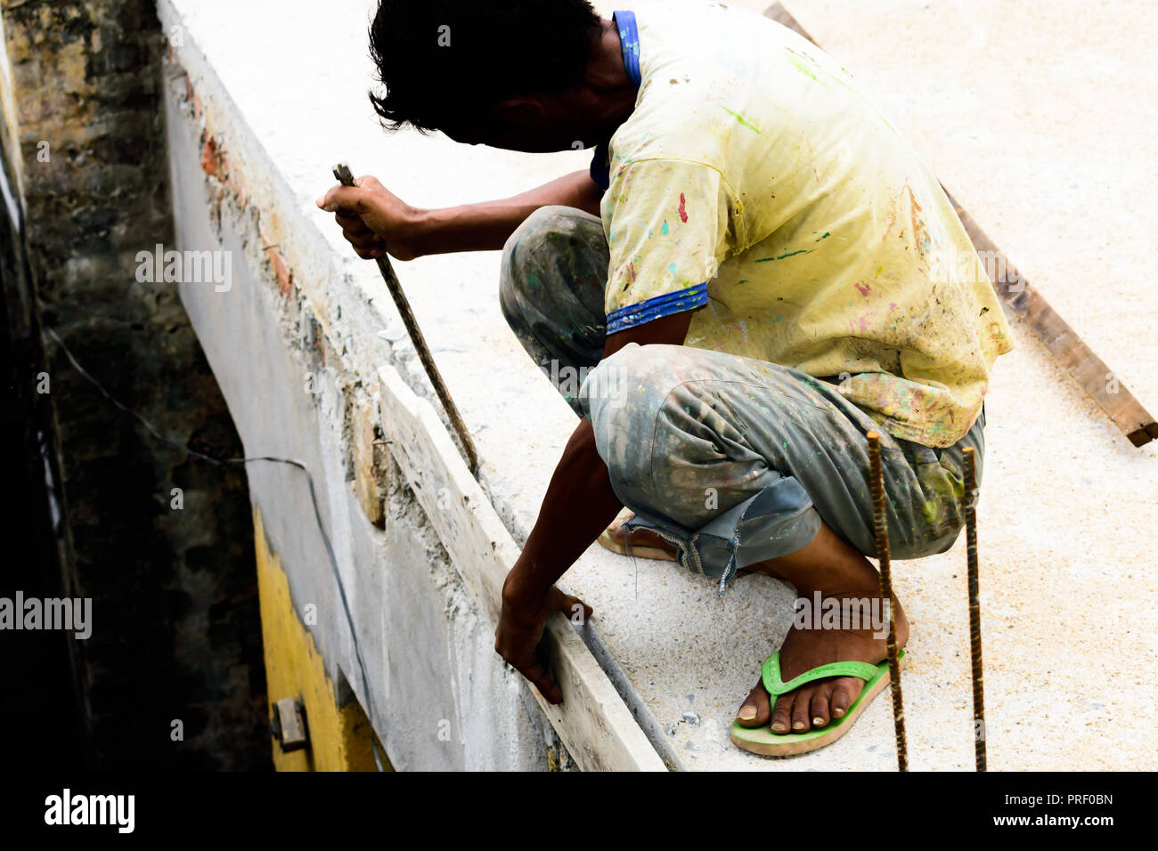industrial worker, bricklayer, mason working on construction site with ...